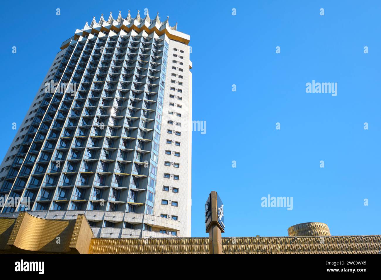 A view of the iconic, 26 floor Hotel Kazakhstan with front gold canopy ...