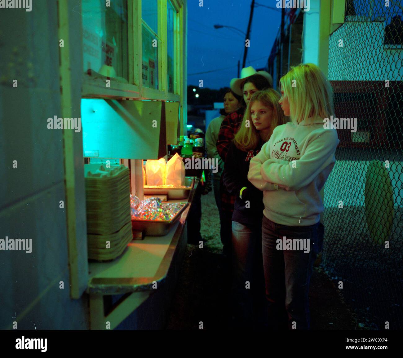 Girls line up at a concession counter Stock Photo - Alamy
