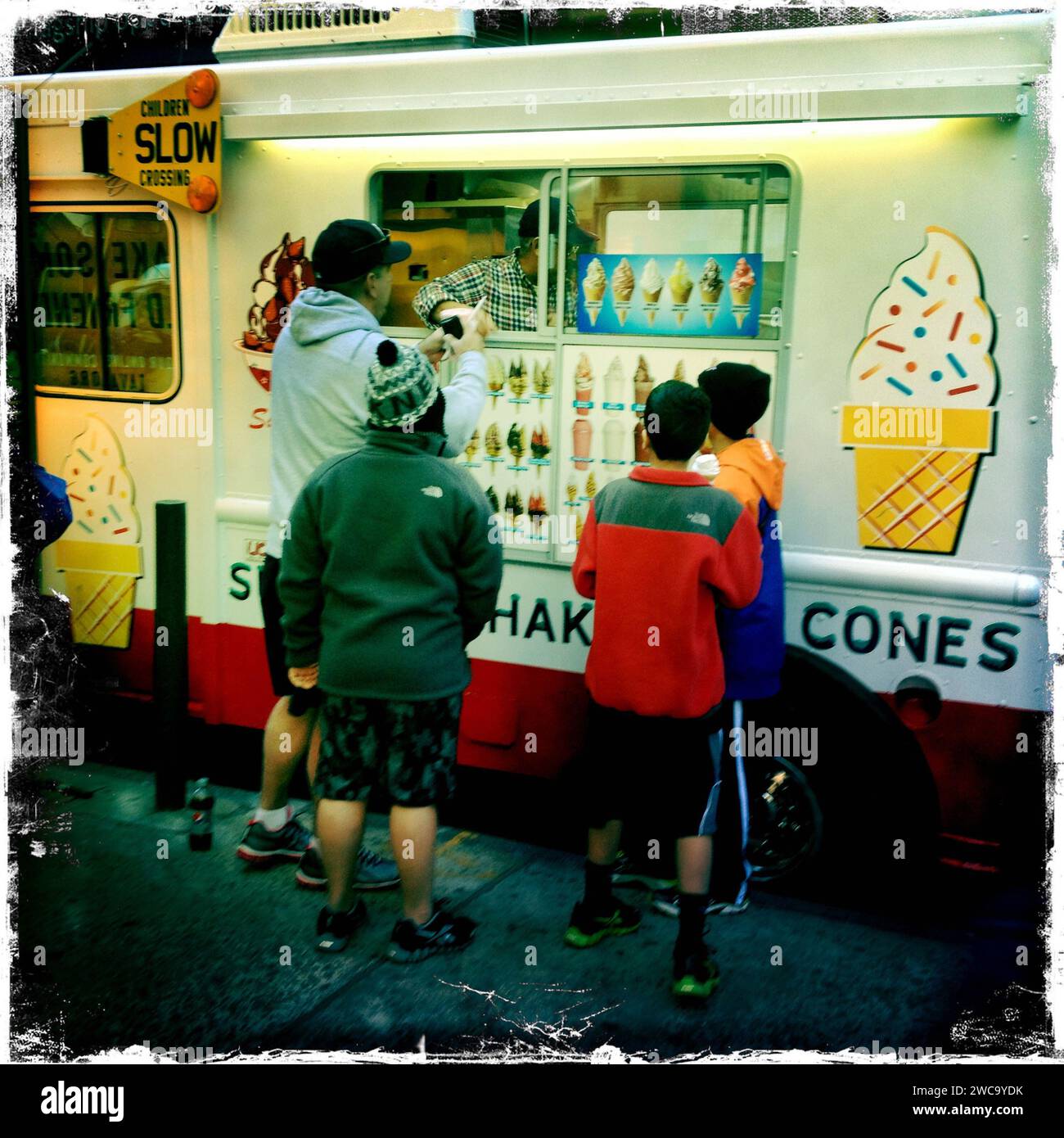 Man and Boys Buying Ice Cream from a Truck Stock Photo - Alamy