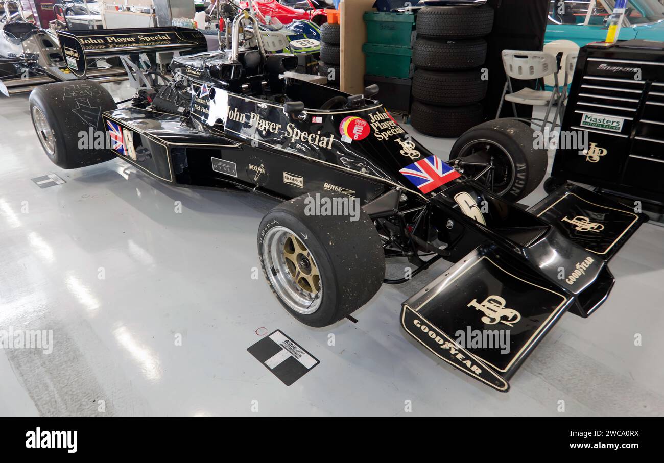 Three-quarters front view of a 1976, Black and Gold, Lotus 77, driven ...
