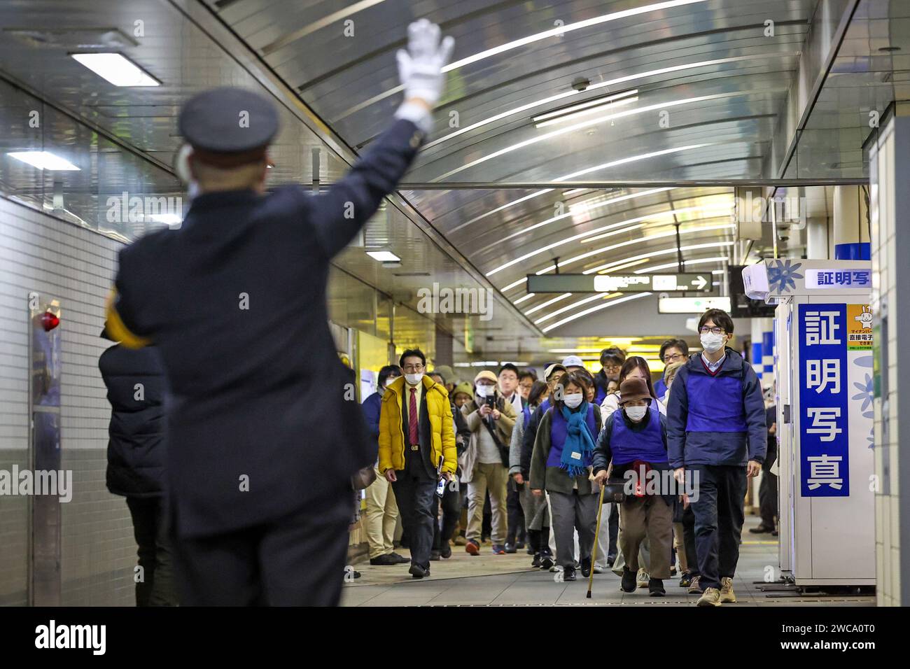 Tokyo, Japan. 15th Jan, 2024. Residents are seen moving through the ...