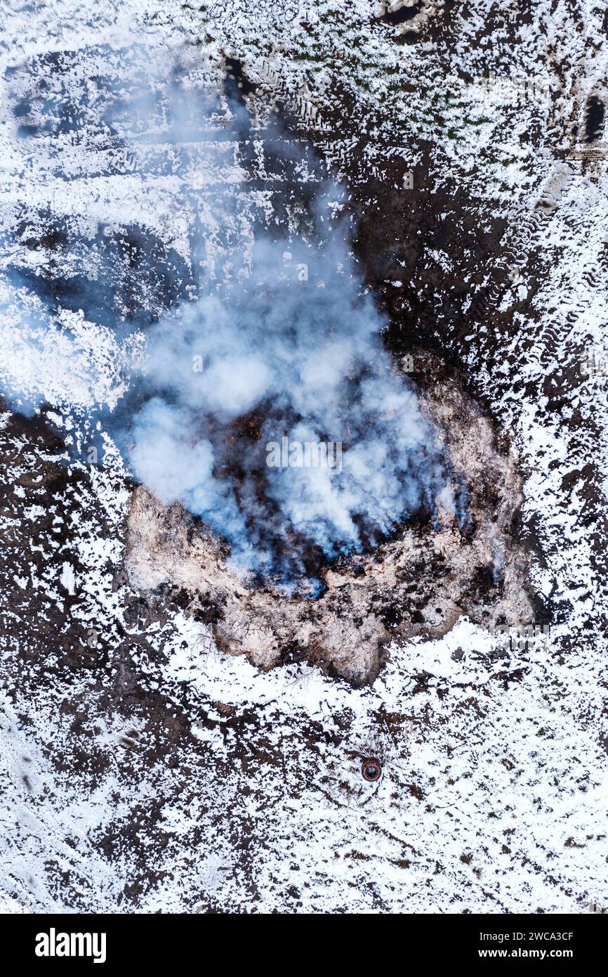 Burning manure pile at farm, air pollution and contamination, aerial ...