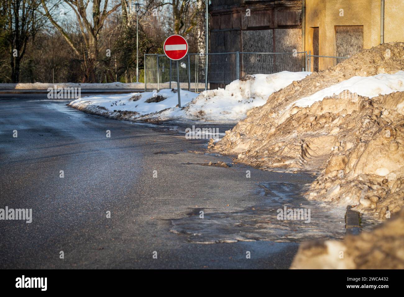 Road during winter, snow on the sides, road sign indicating that entry ...