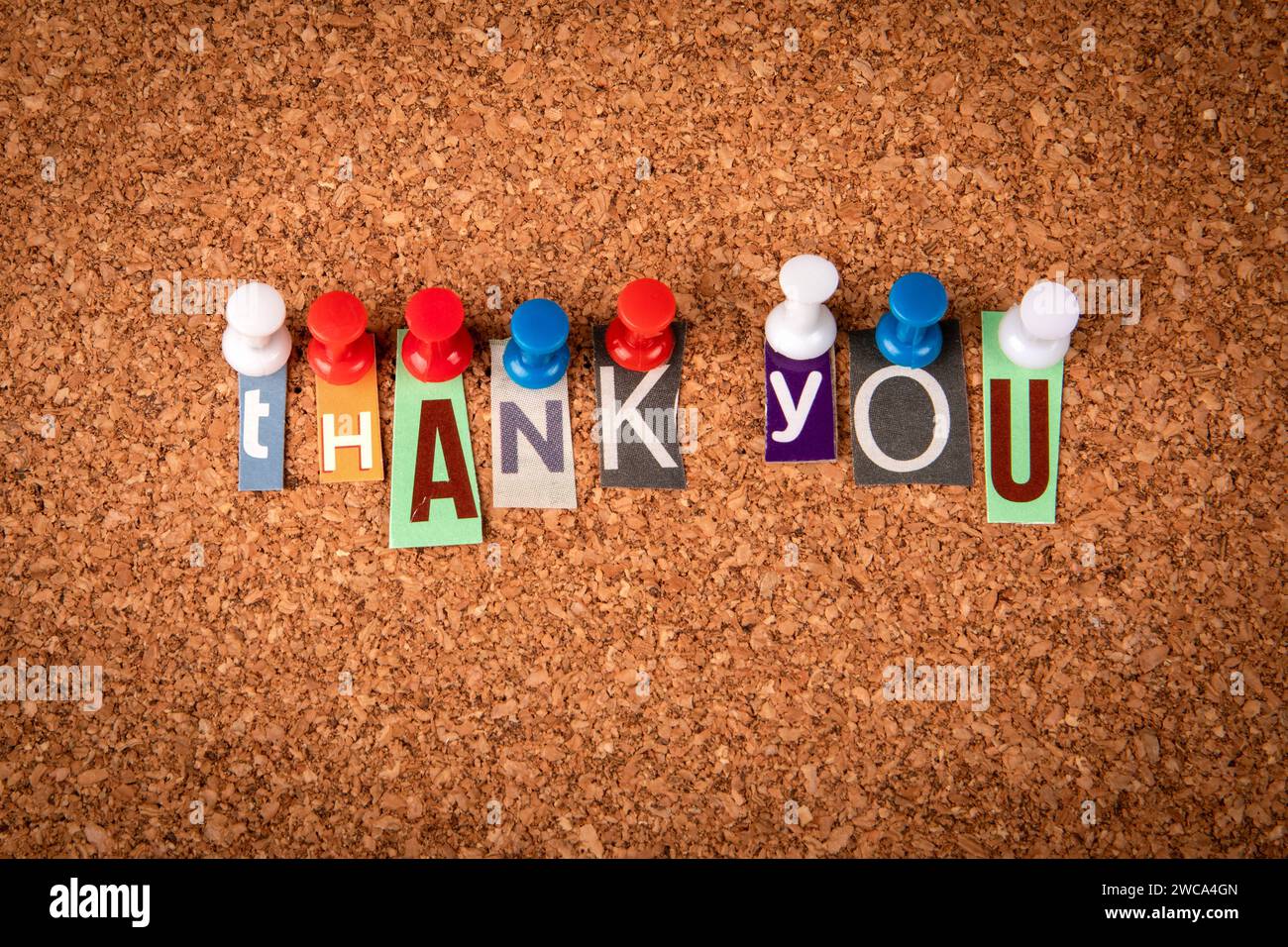 THANK YOU. Letters pinned to a cork notice board Stock Photo - Alamy