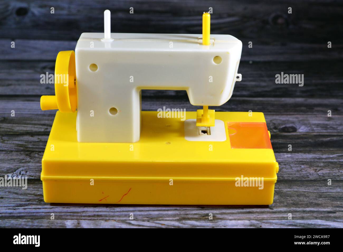 plastic toy for a swing machine to teach children how to sew fabric ...