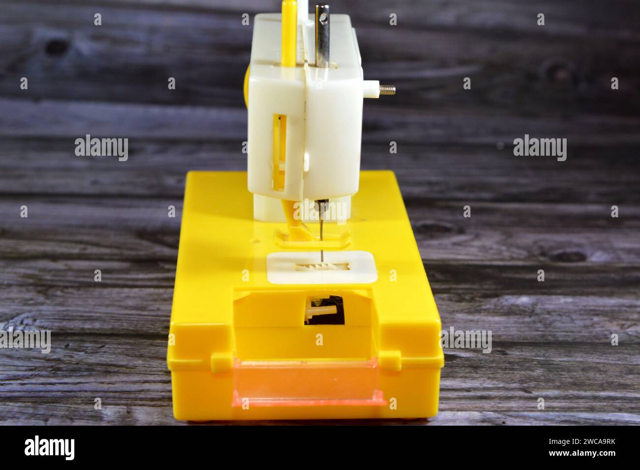 plastic toy for a swing machine to teach children how to sew fabric ...