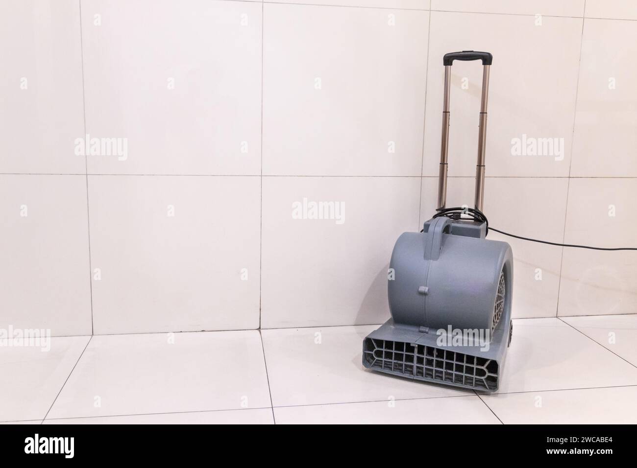 Floor dryer fan used in public washroom and toilet to dry the floor ...