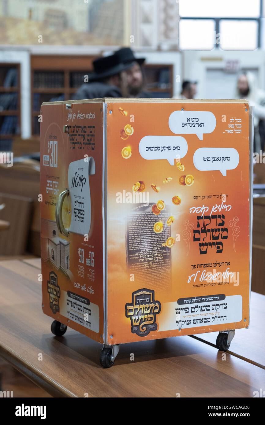 A very large charity box called a pushka collecting for a needy family ...