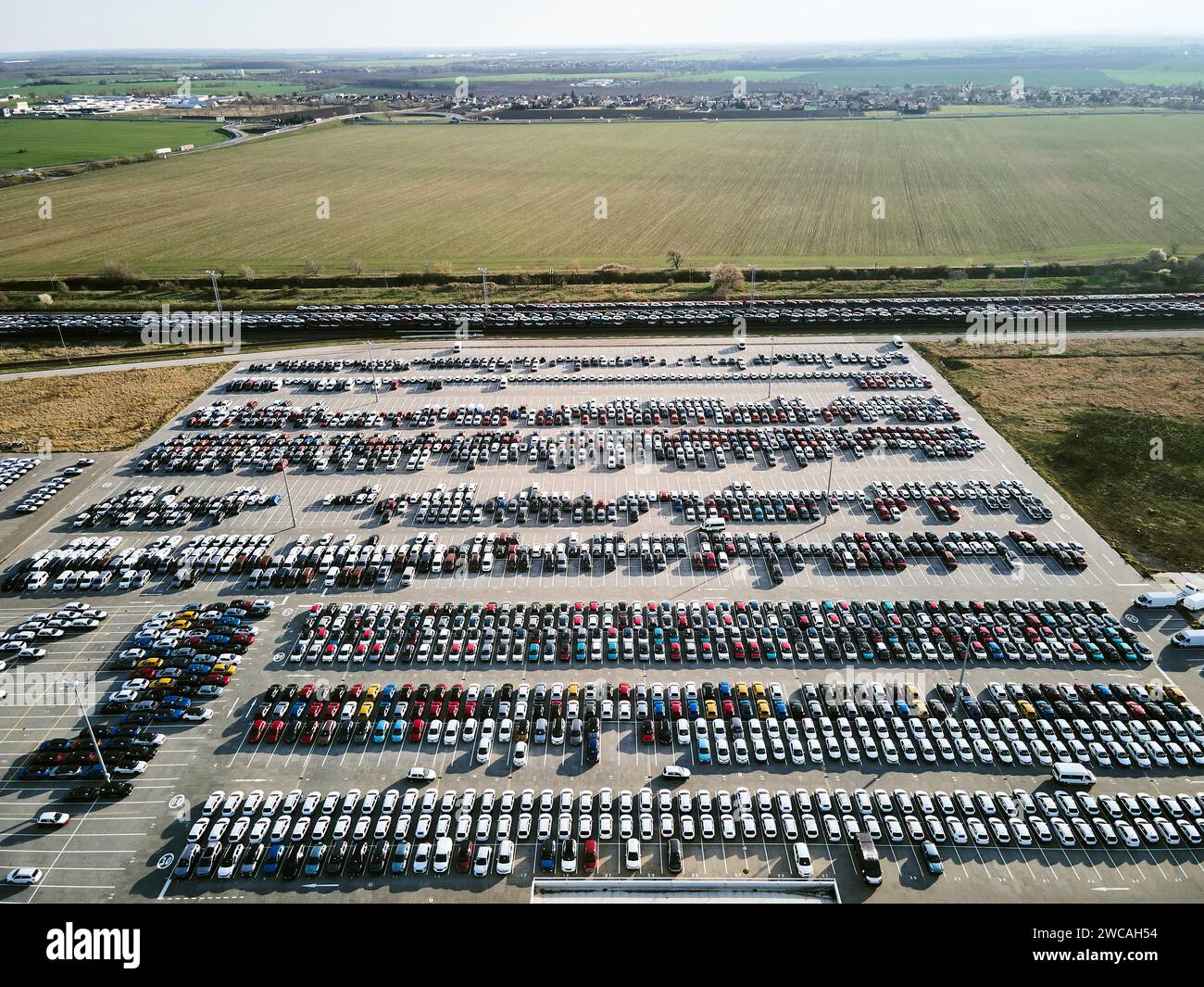 Aerial view of a massive parking lot at a car manufacturing facility ...