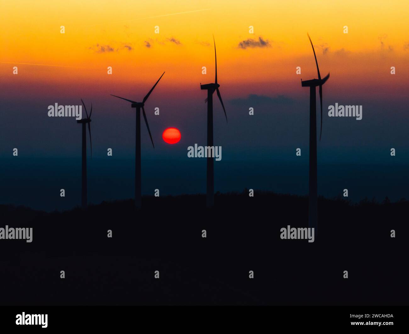 Aerial landscape photography of sunrise over nature with wind turbines ...