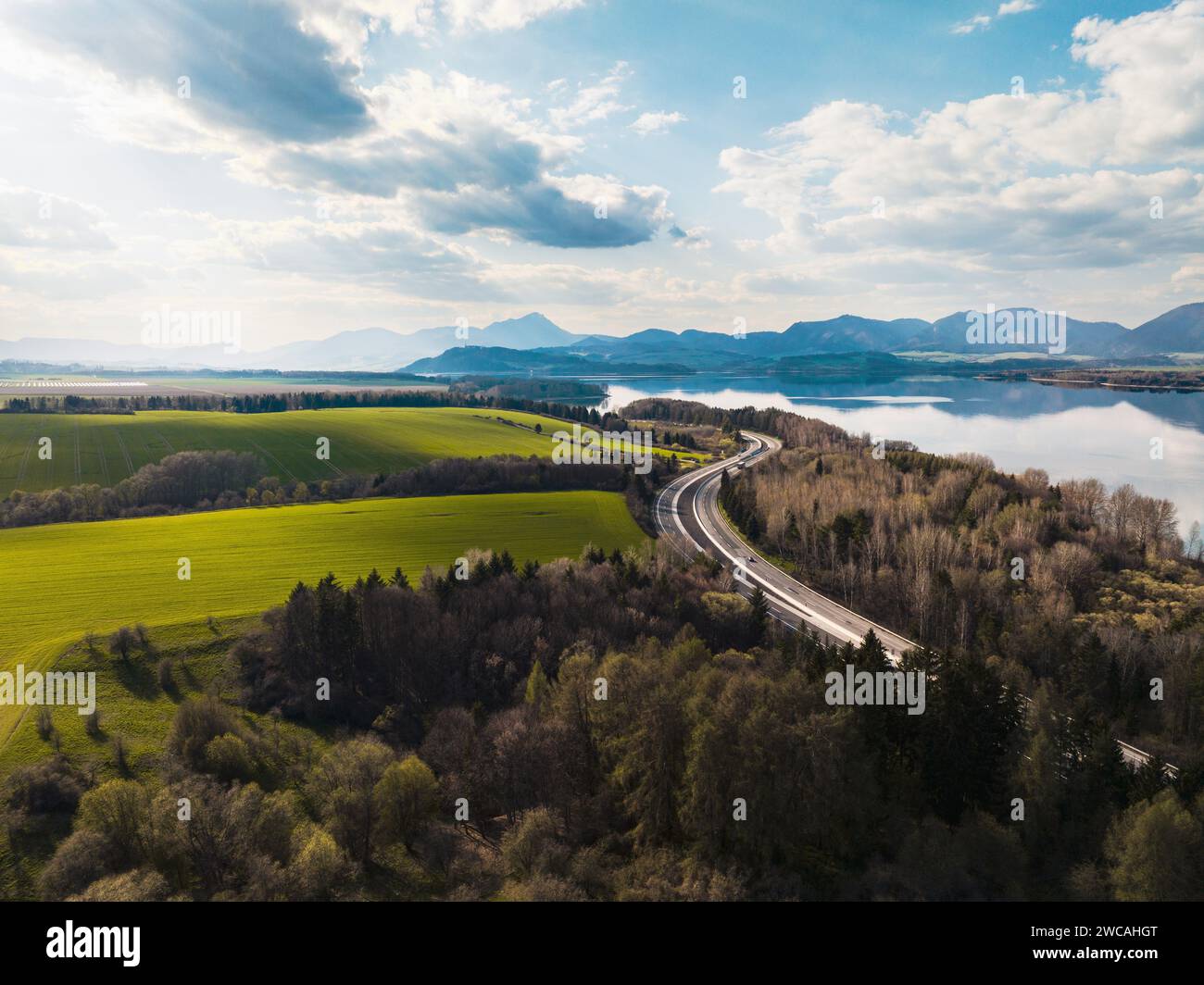 Aerial view of green summer nature with lake, crops or pasture with ...