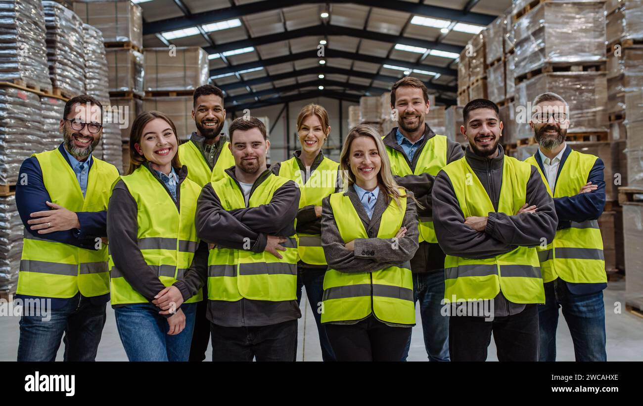Full team of warehouse employees standing in warehouse. Team of workers ...