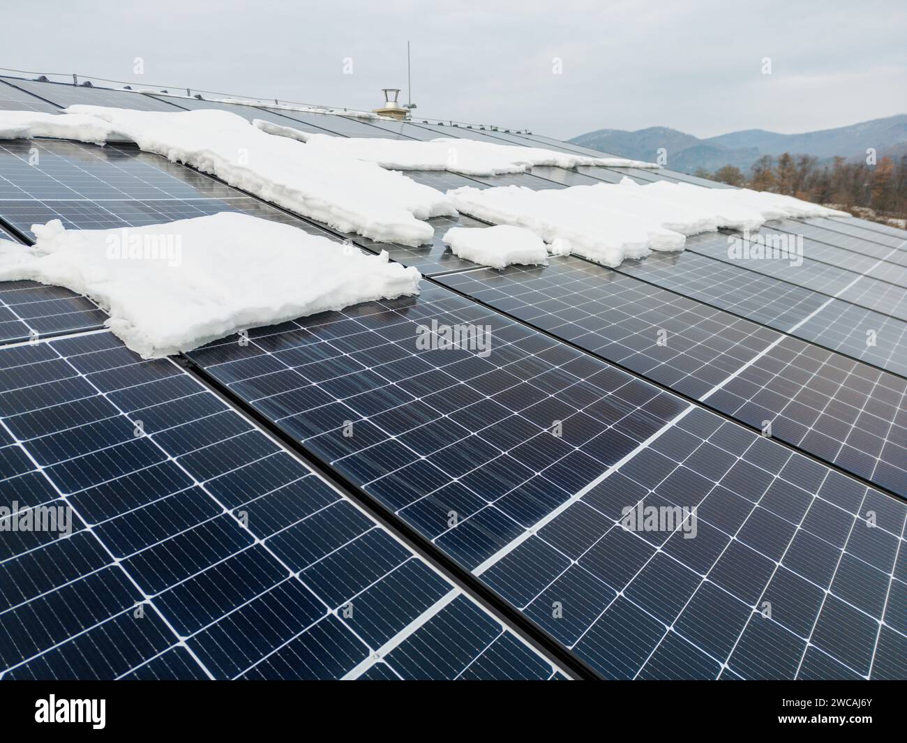 Snowing on solar panels roof hi-res stock photography and images - Alamy