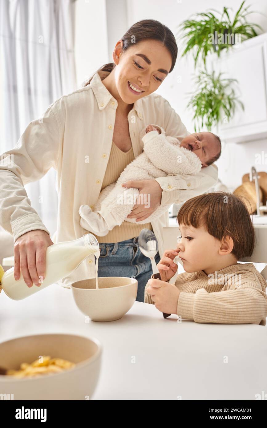Mom pouring milk kids hi-res stock photography and images - Alamy