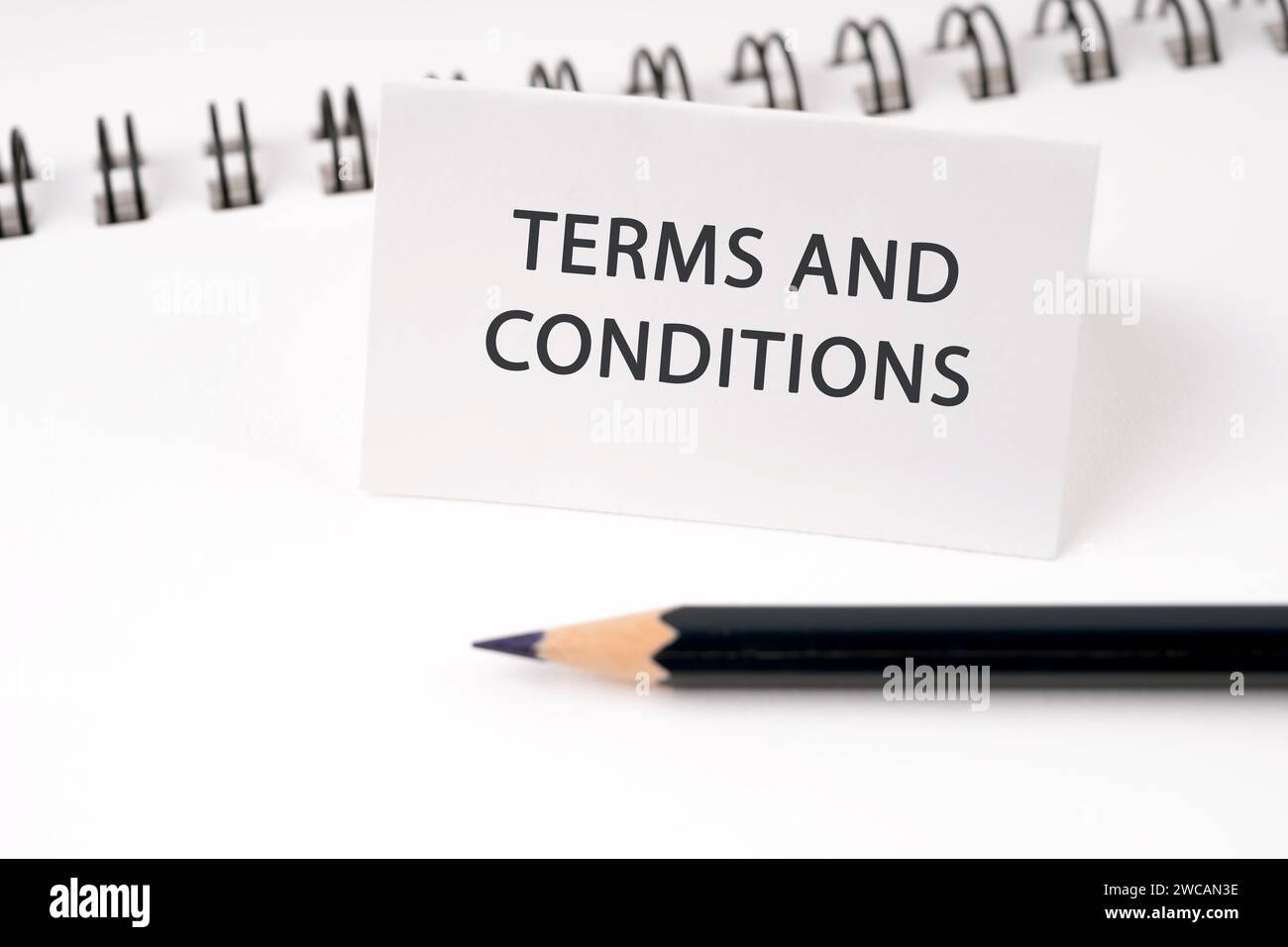 Terms and conditions on a paper note on blue background Stock Photo - Alamy