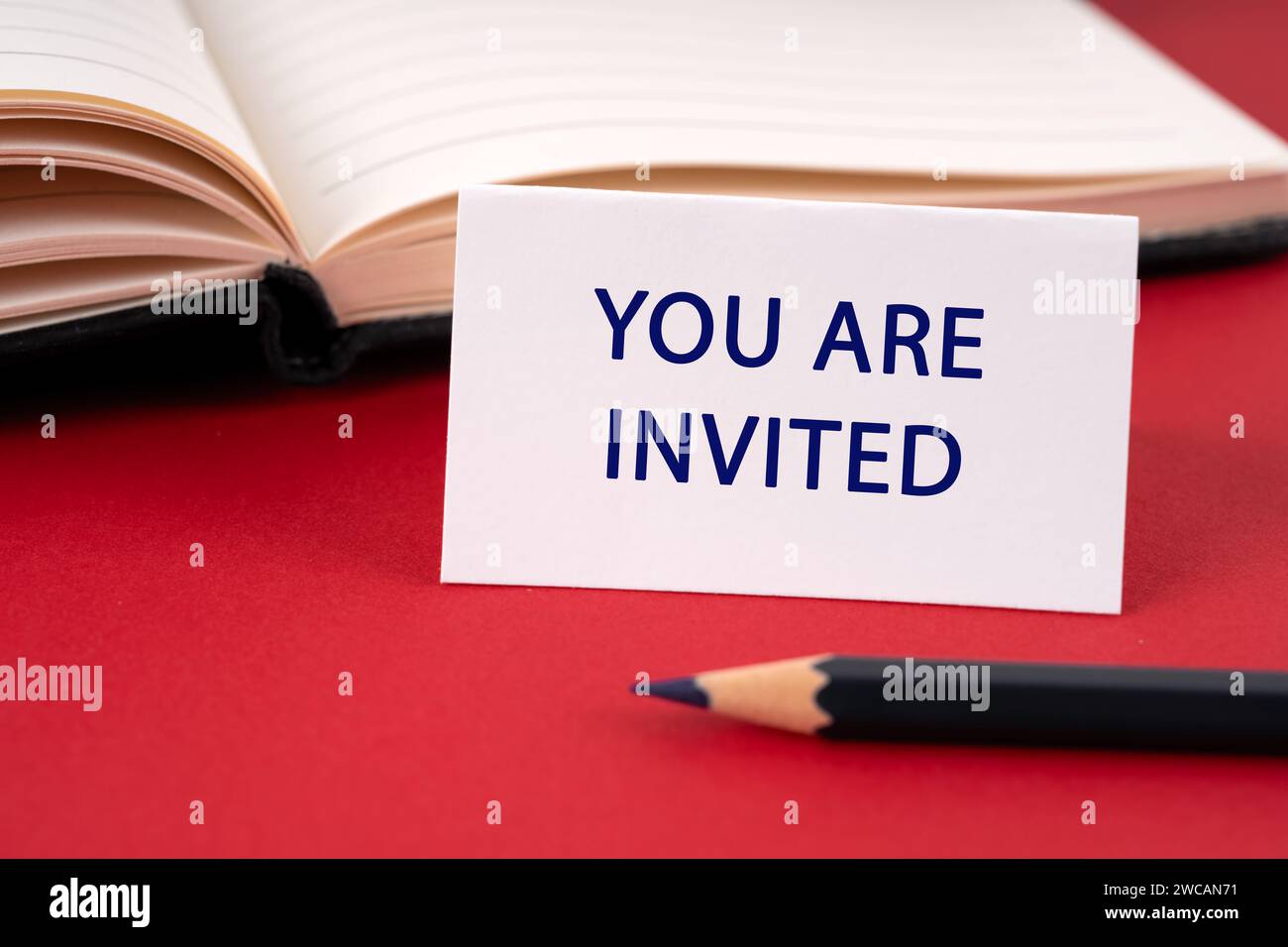You are invited text on a paper note Stock Photo - Alamy