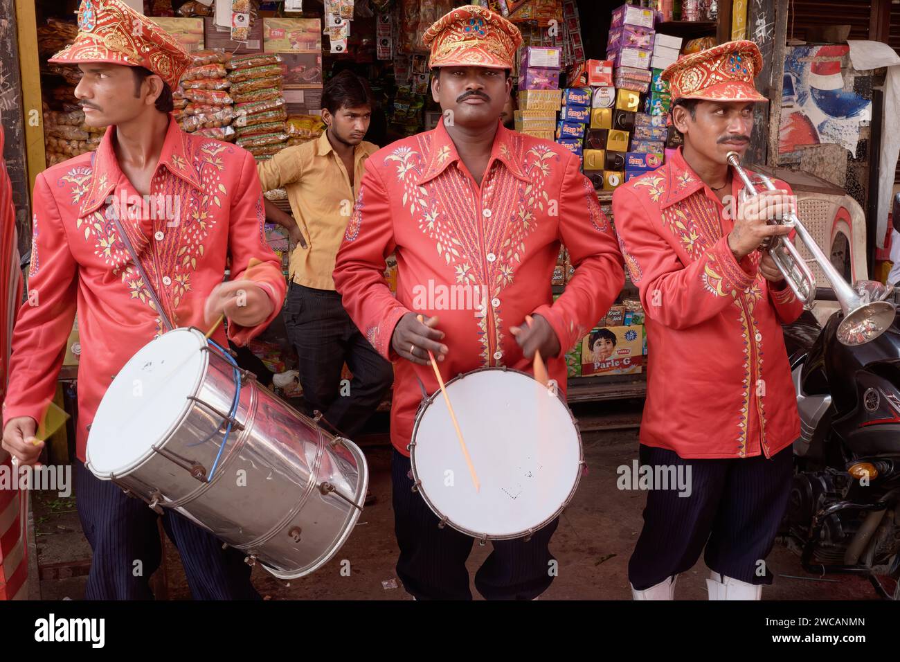 Three uniformed members of a band employed for weddings and other ...