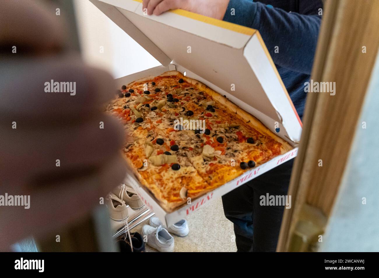 Augsburg, Bavaria, Germany - January 14, 2024: Pizza delivery man ...
