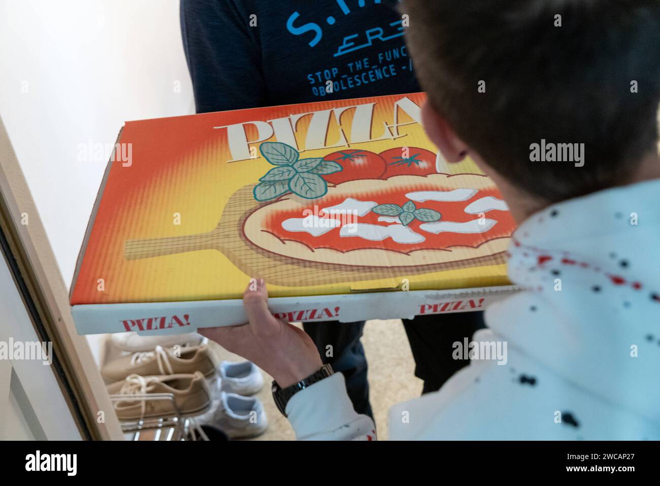 Augsburg, Bavaria, Germany - January 14, 2024: Pizza delivery man ...