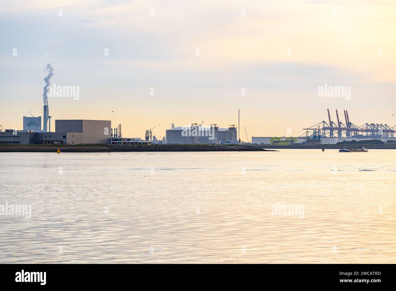 View of a major seaport with fuel storage tanks, warehouses, gantry ...
