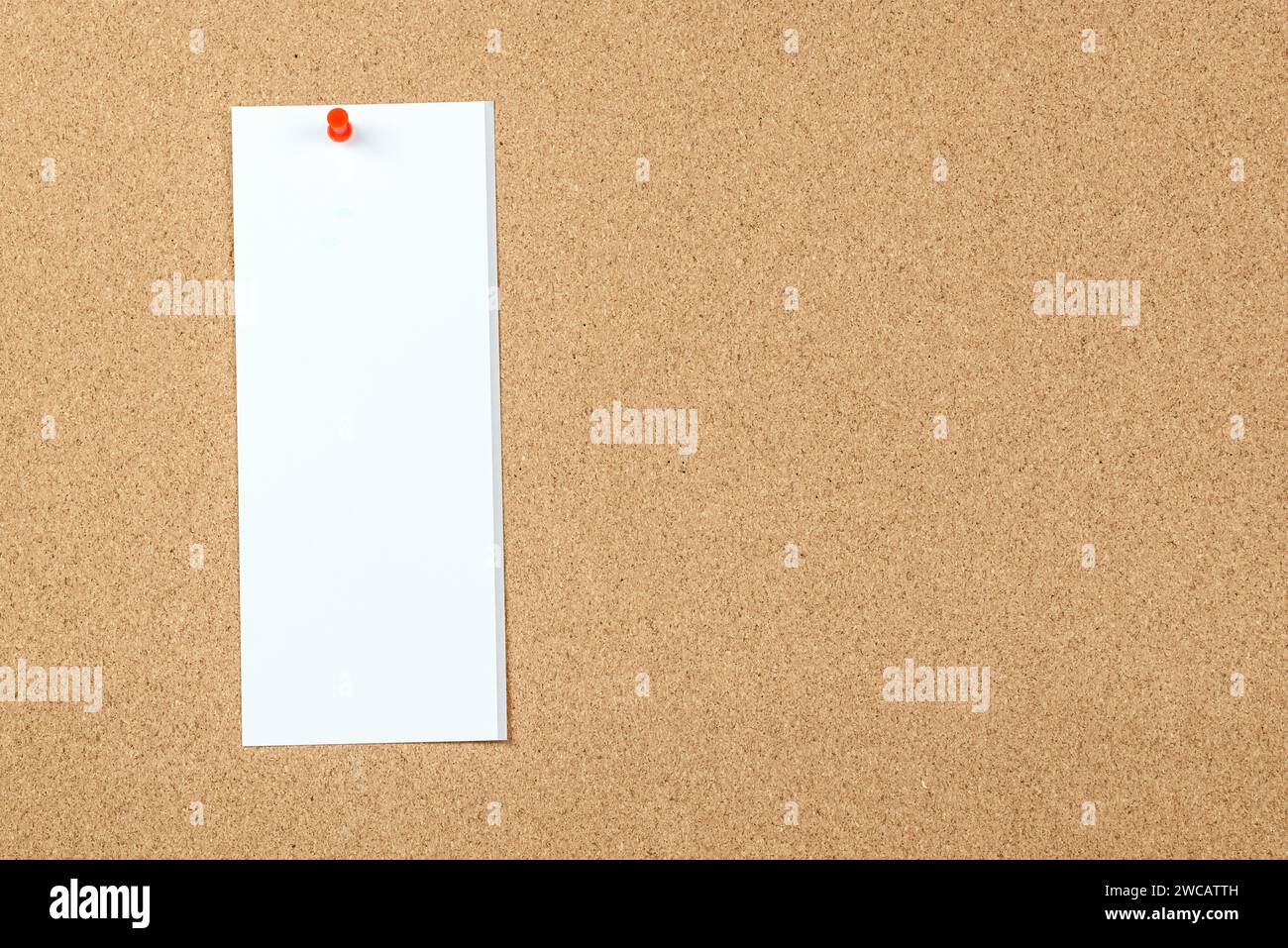 Blank sheet of paper pinned to a cork board. Copy space Stock Photo - Alamy