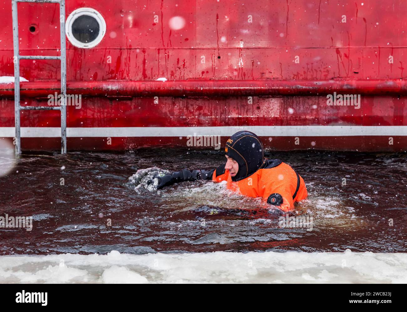 A rescue diver seen training to save fishermen fishing on the ice of ...