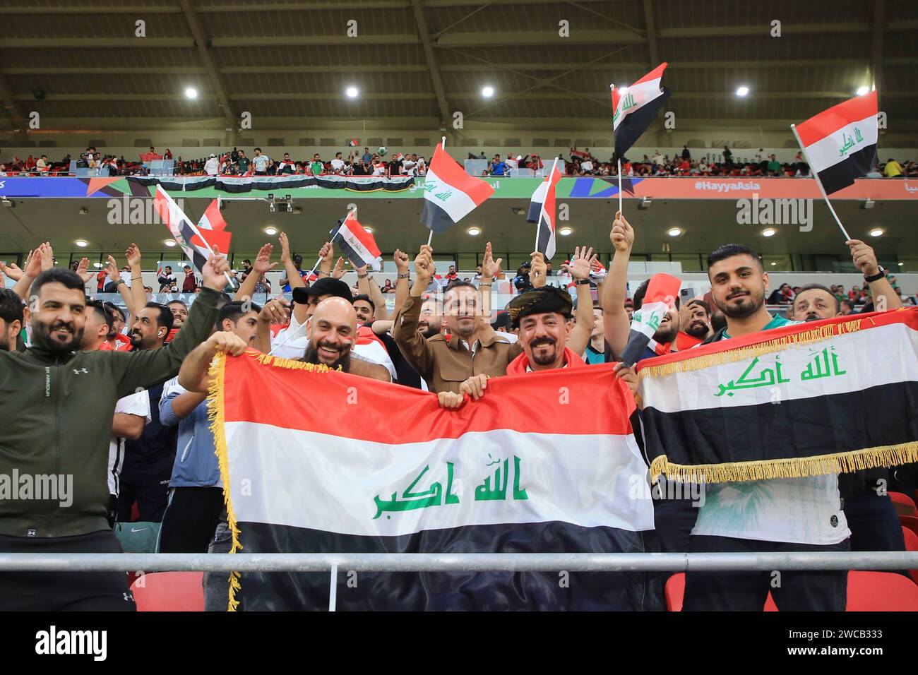 Iraqi fans wave their national flags ahead of the Asian Cup Group D ...