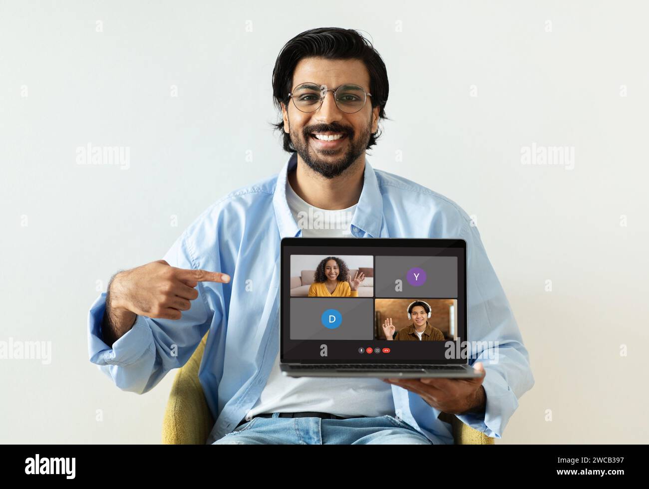 Cheerful indian man showing laptop with video call screen Stock Photo ...