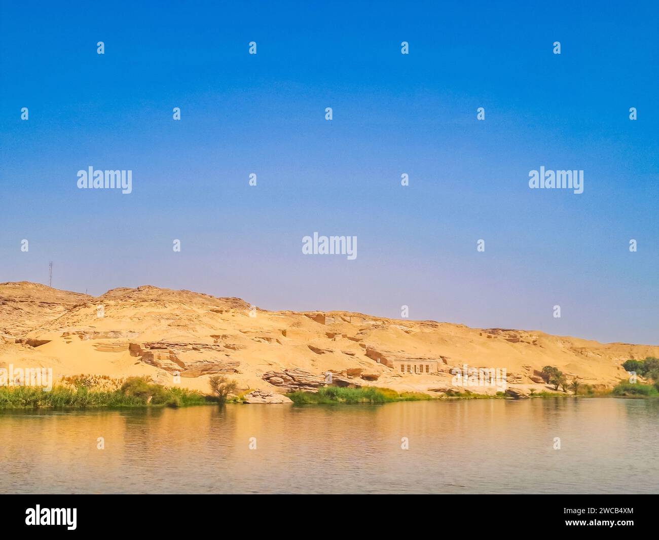 Aswan view on the Nile river and the tombs of nobles with a blue sky ...