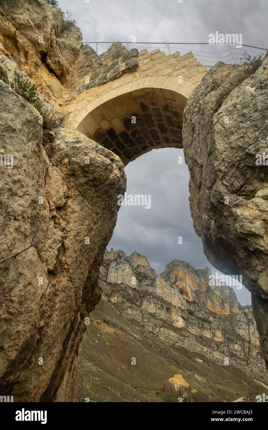 Ancient stone arch built on the rock at Pancorbo castle, mountain pass ...