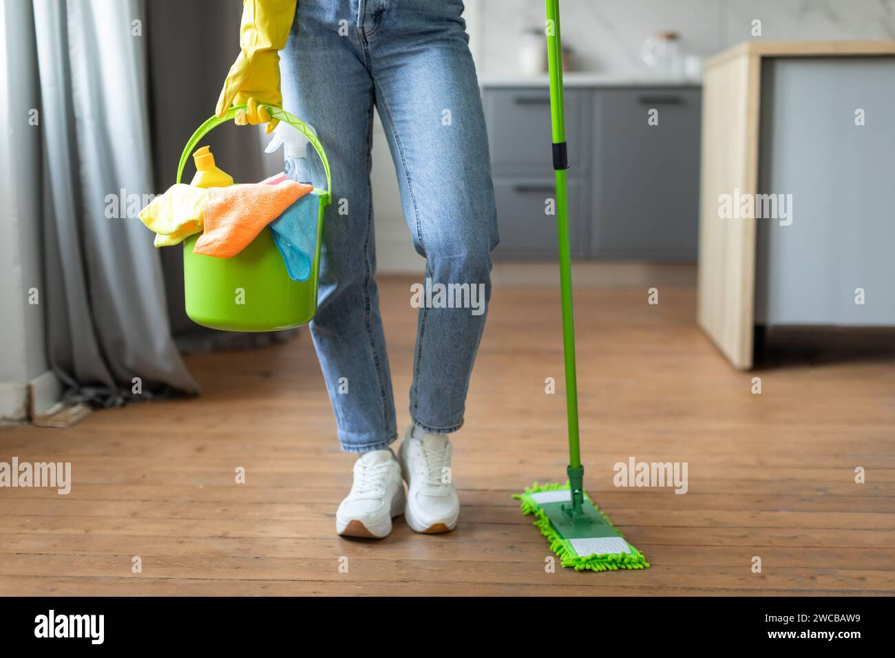 Woman with bucket and mop ready for floor cleaning Stock Photo - Alamy