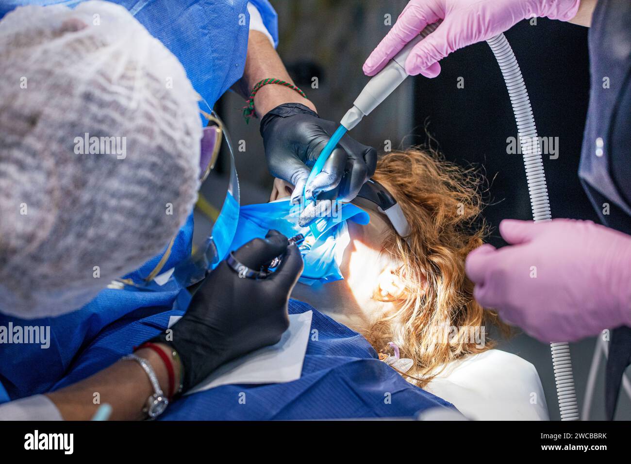 dentist giving an anesthesia injection to a patient's pus before his ...
