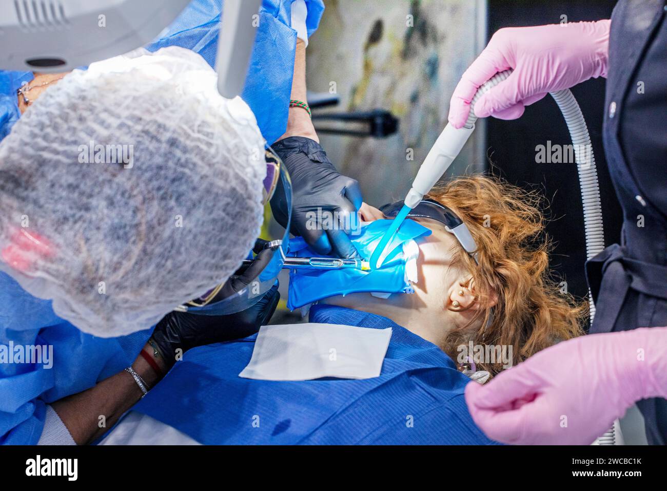 give an injection of anesthesia to a sick woman before his treatment ...