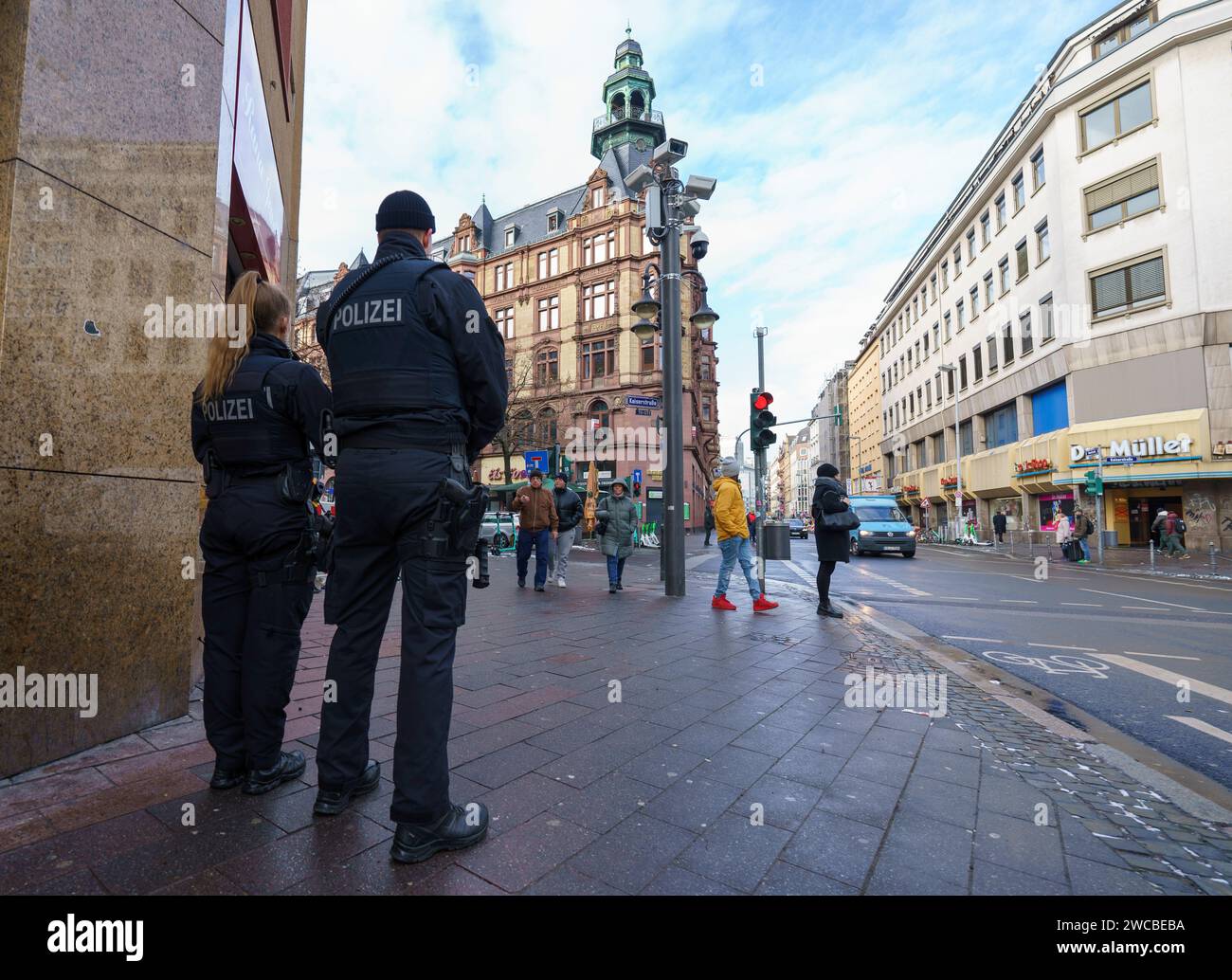 15 January 2024, Hesse, Frankfurt/Main: Two police officers stand at ...