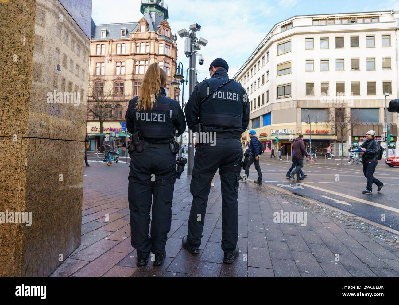 15 January 2024, Hesse, Frankfurt/Main: Two police officers stand at ...