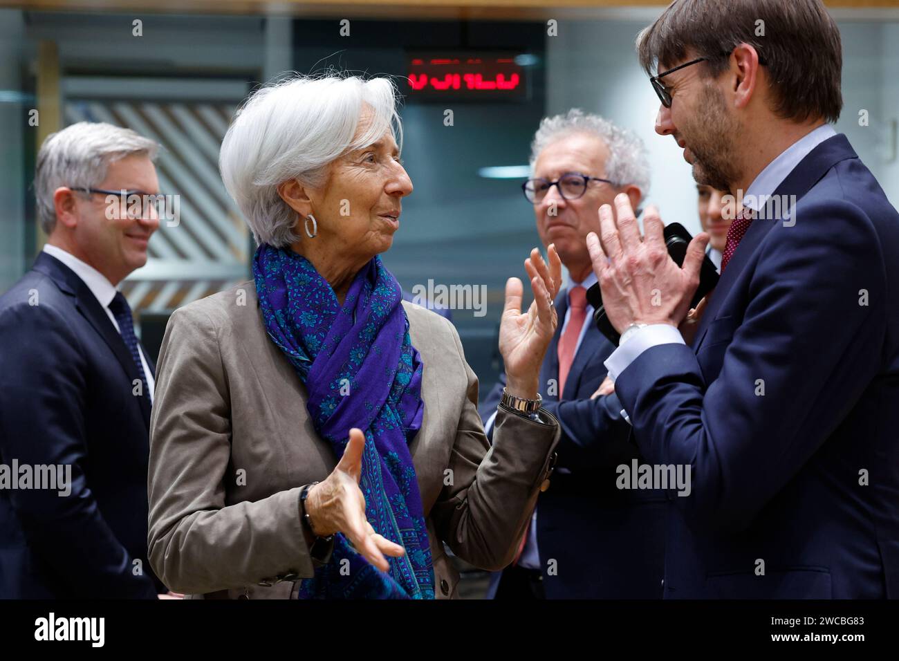 European Central Bank President Christine Lagarde, left, speaks with ...