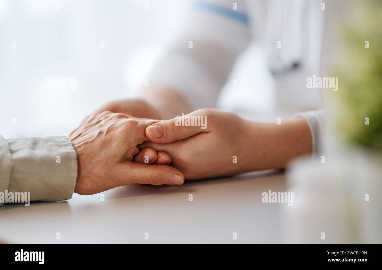 Female patient with doctor in medical office. Support of people living ...