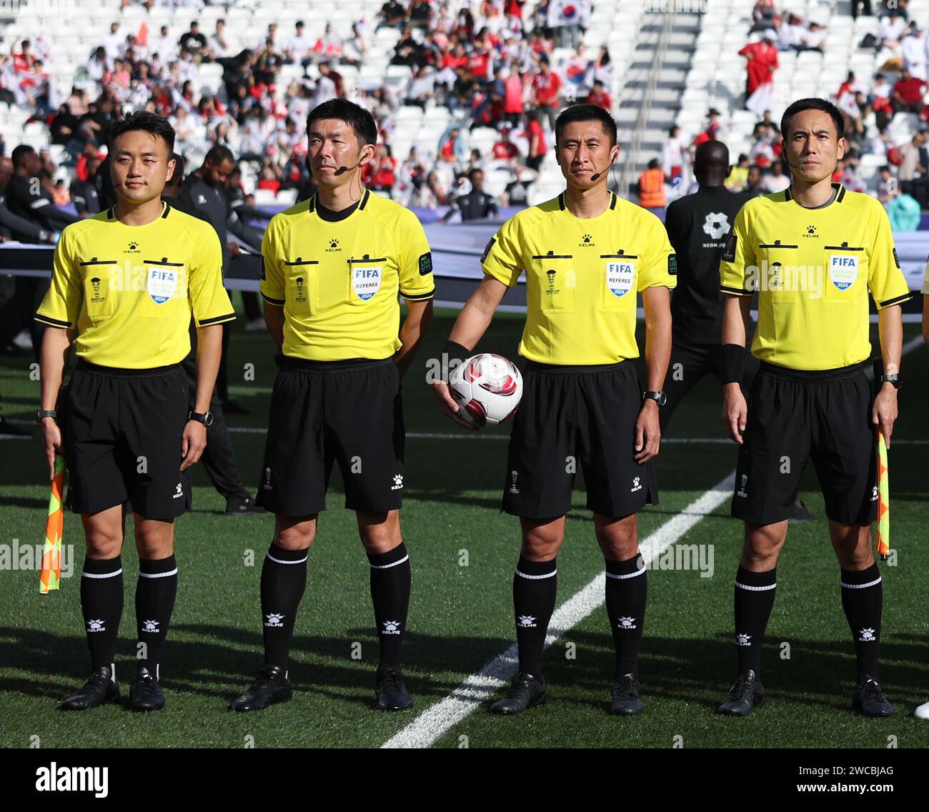 Doha, Qatar. 15th Jan, 2024. Chinese referee Ma Ning (2nd R), assistant ...