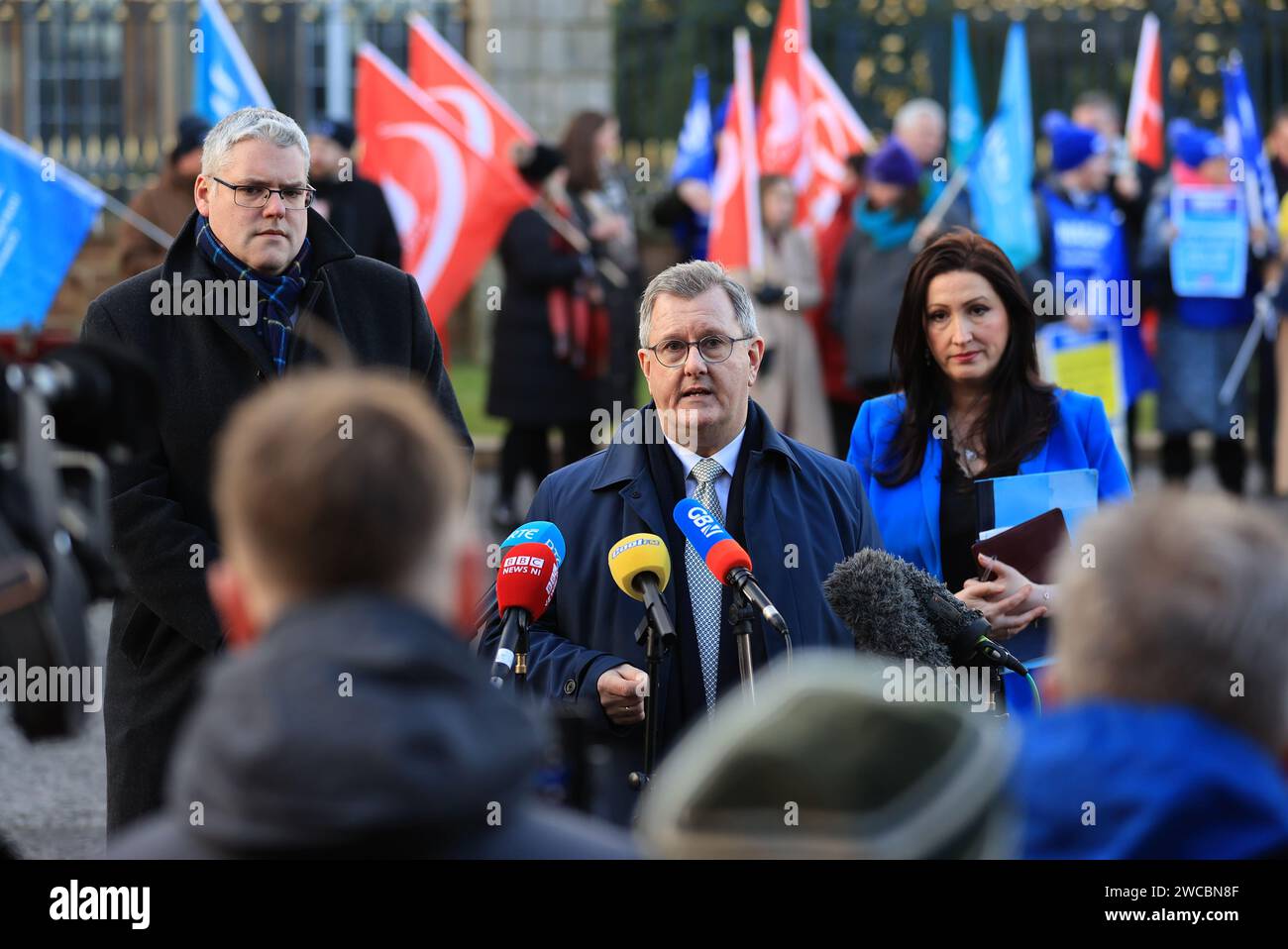 DUP leader Sir Jeffrey Donaldson (centre) speaking to the media with ...