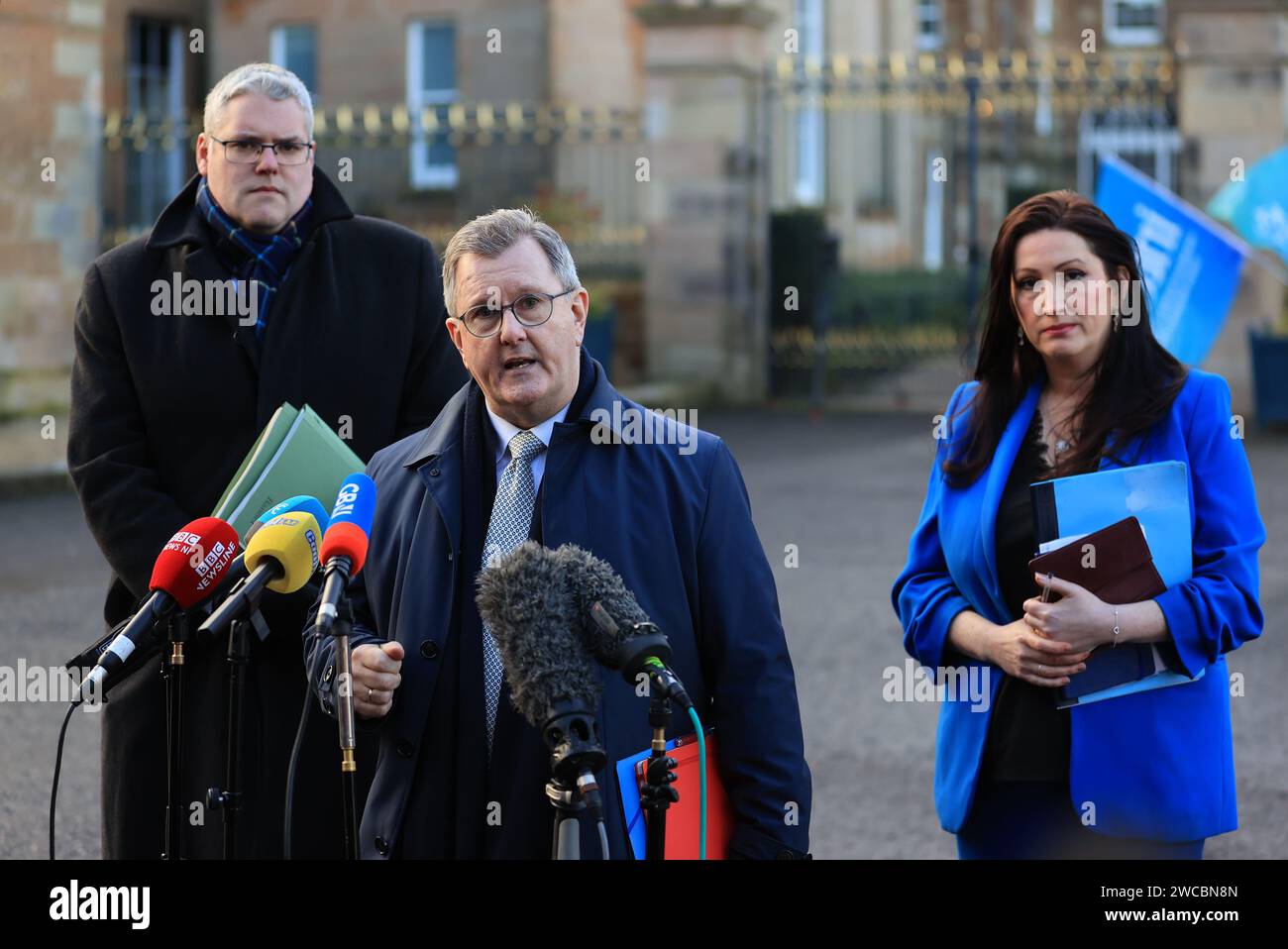 DUP leader Sir Jeffrey Donaldson (centre) speaking to the media with ...