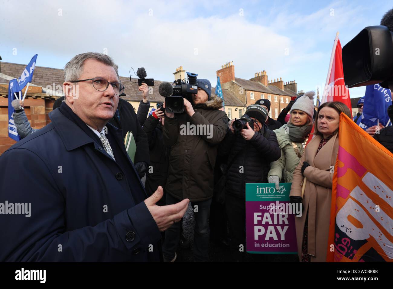 DUP leader Sir Jeffrey Donaldson (left) speaking to representatives ...