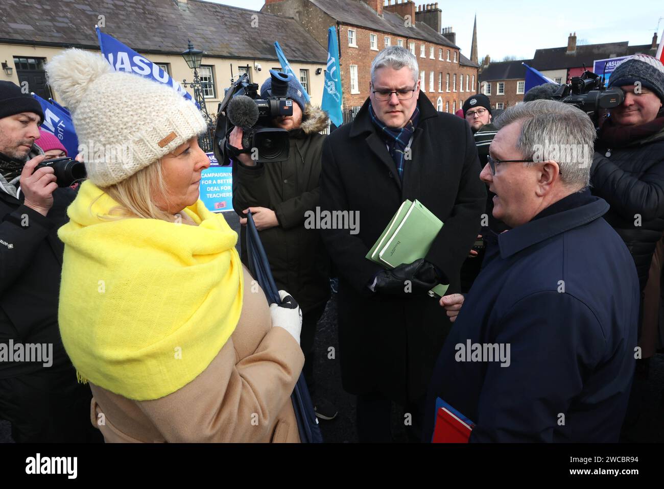DUP leader Sir Jeffrey Donaldson (right) speaking to representatives ...