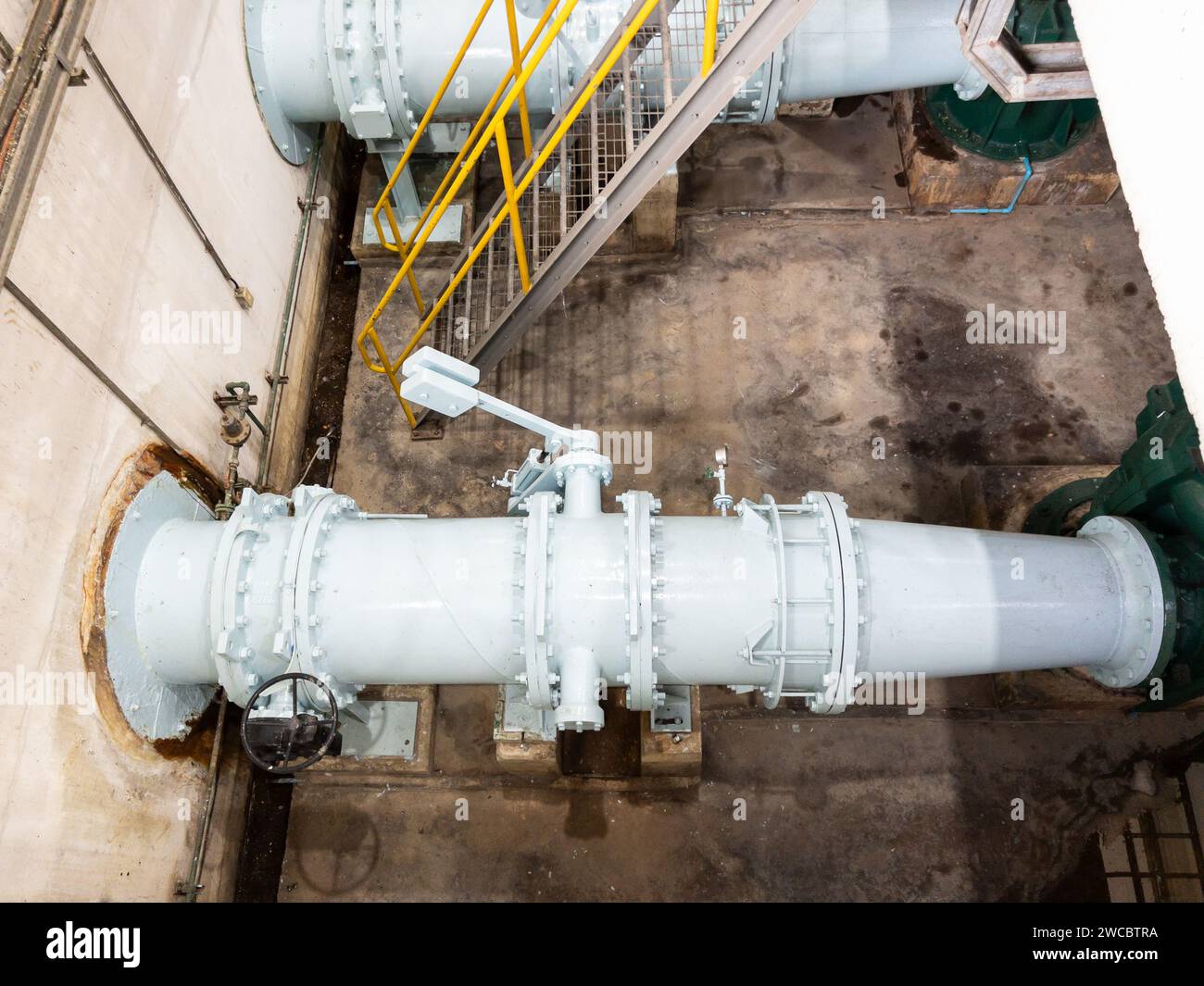 The large metal pipe with the safety valve that connects to the water ...