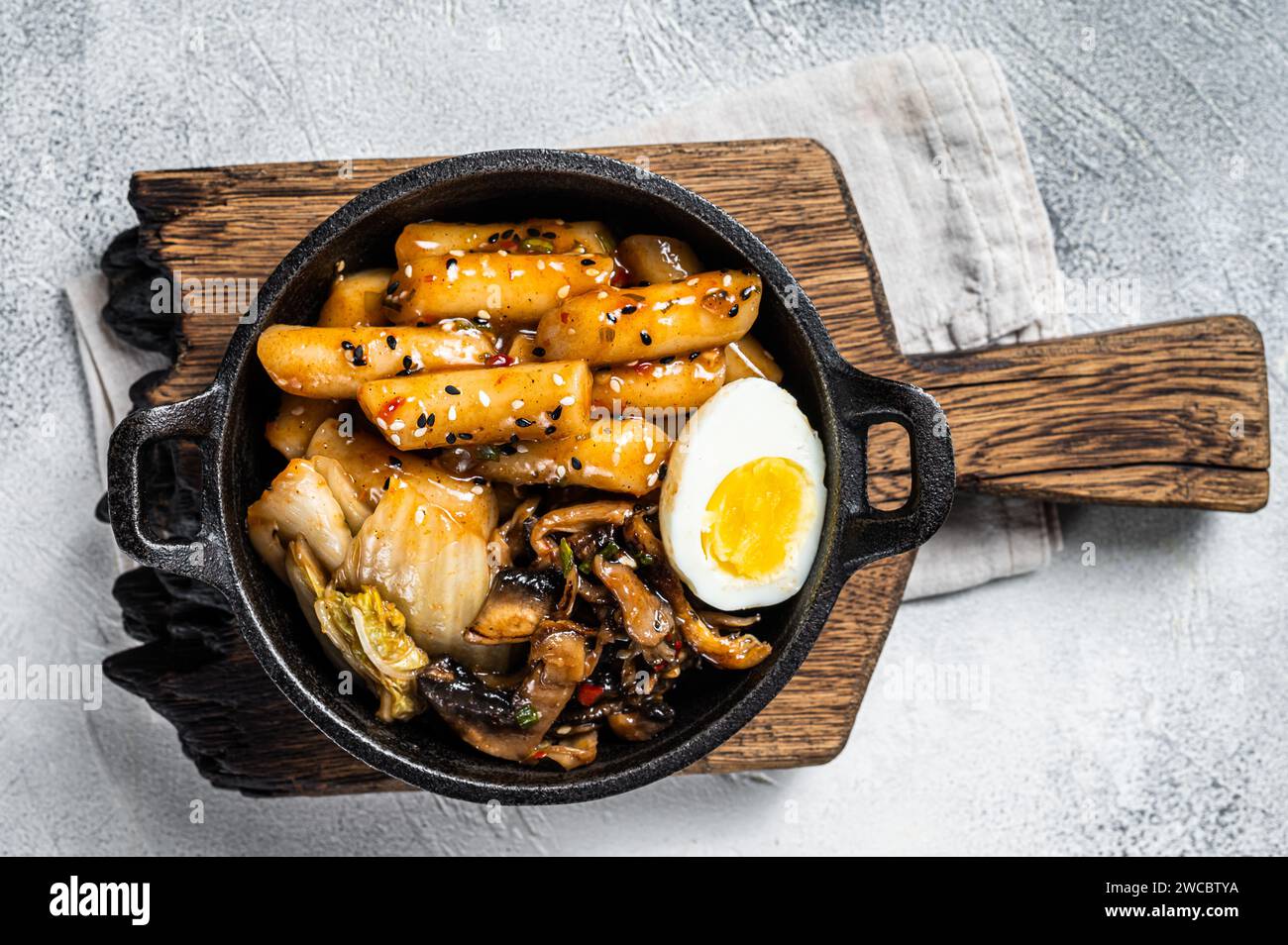 Tteokbokki, Topokki stick rice cake in spicy sauce with egg and ...