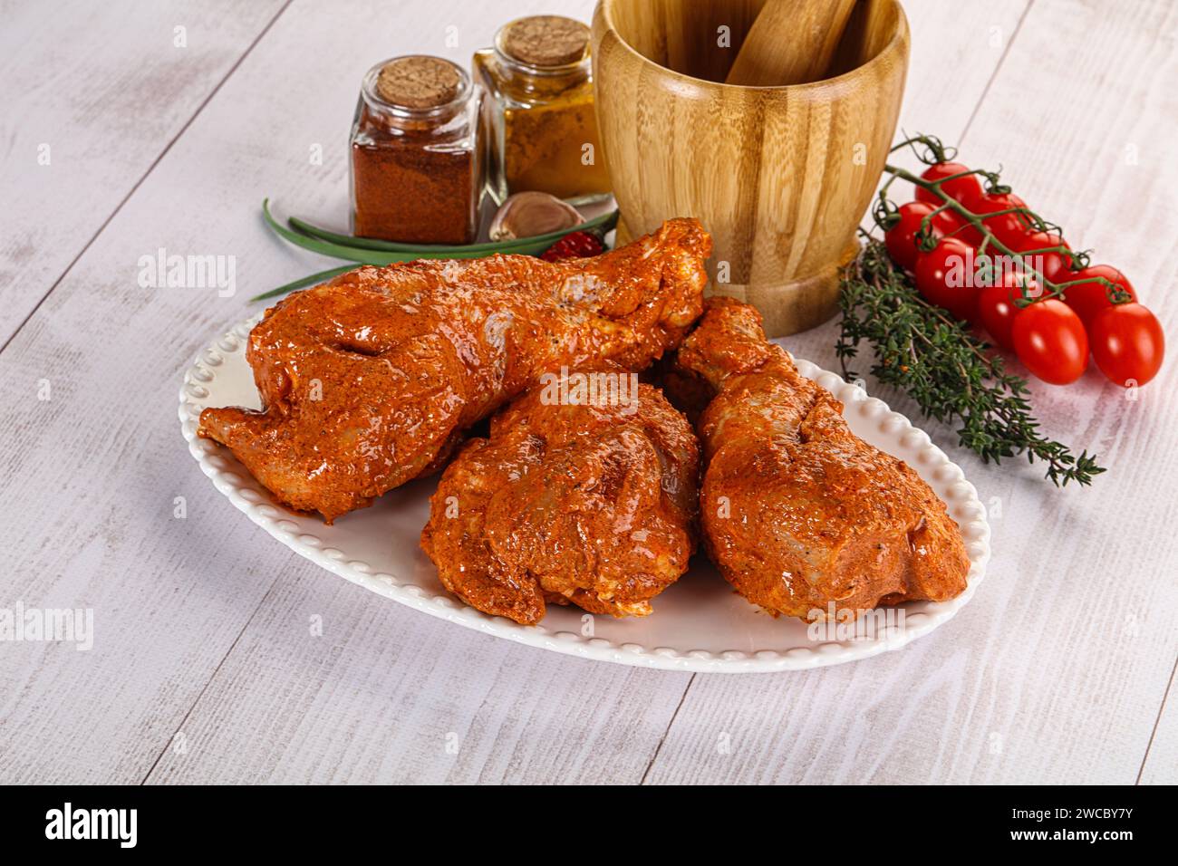 Raw turkey shoulder wing in Indian tandoori marinade spices Stock Photo ...