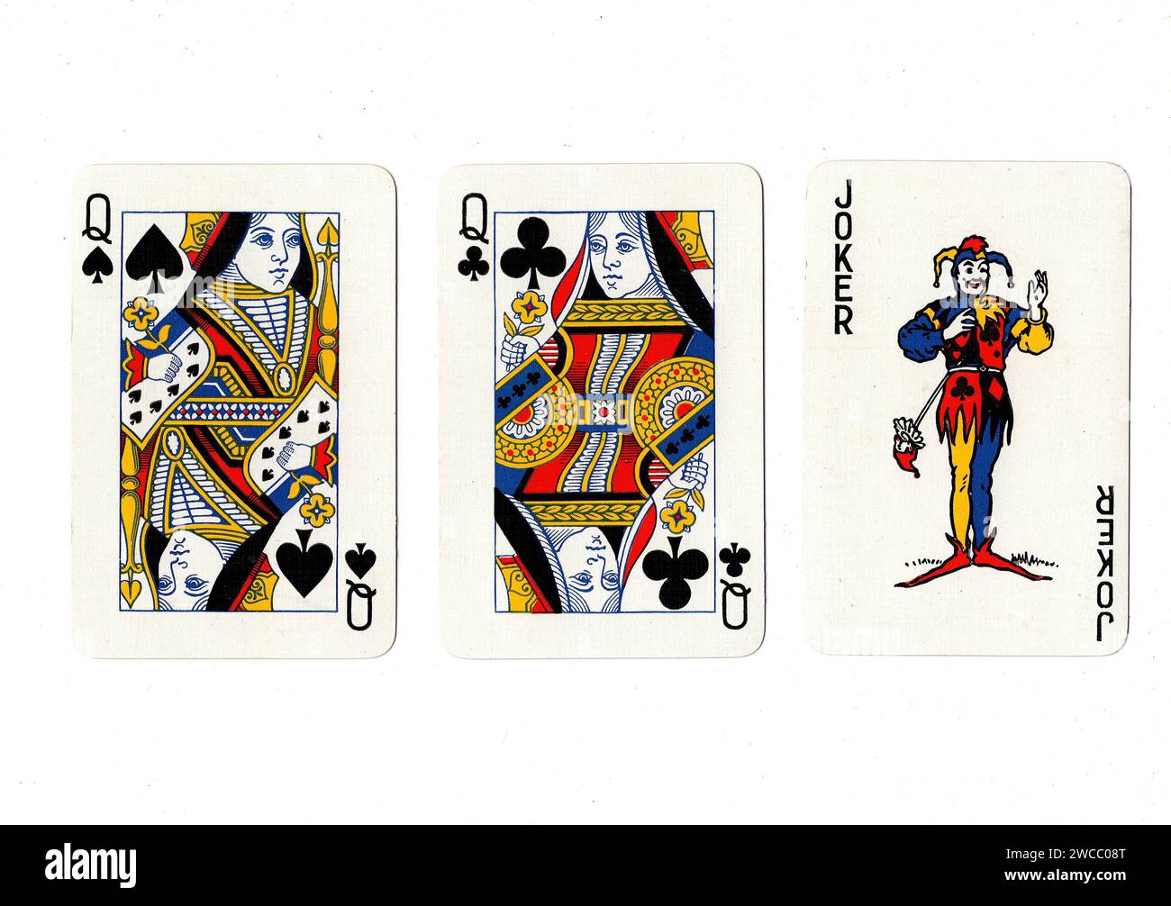 Vintage playing cards showing a pair of black queens and a joker ...