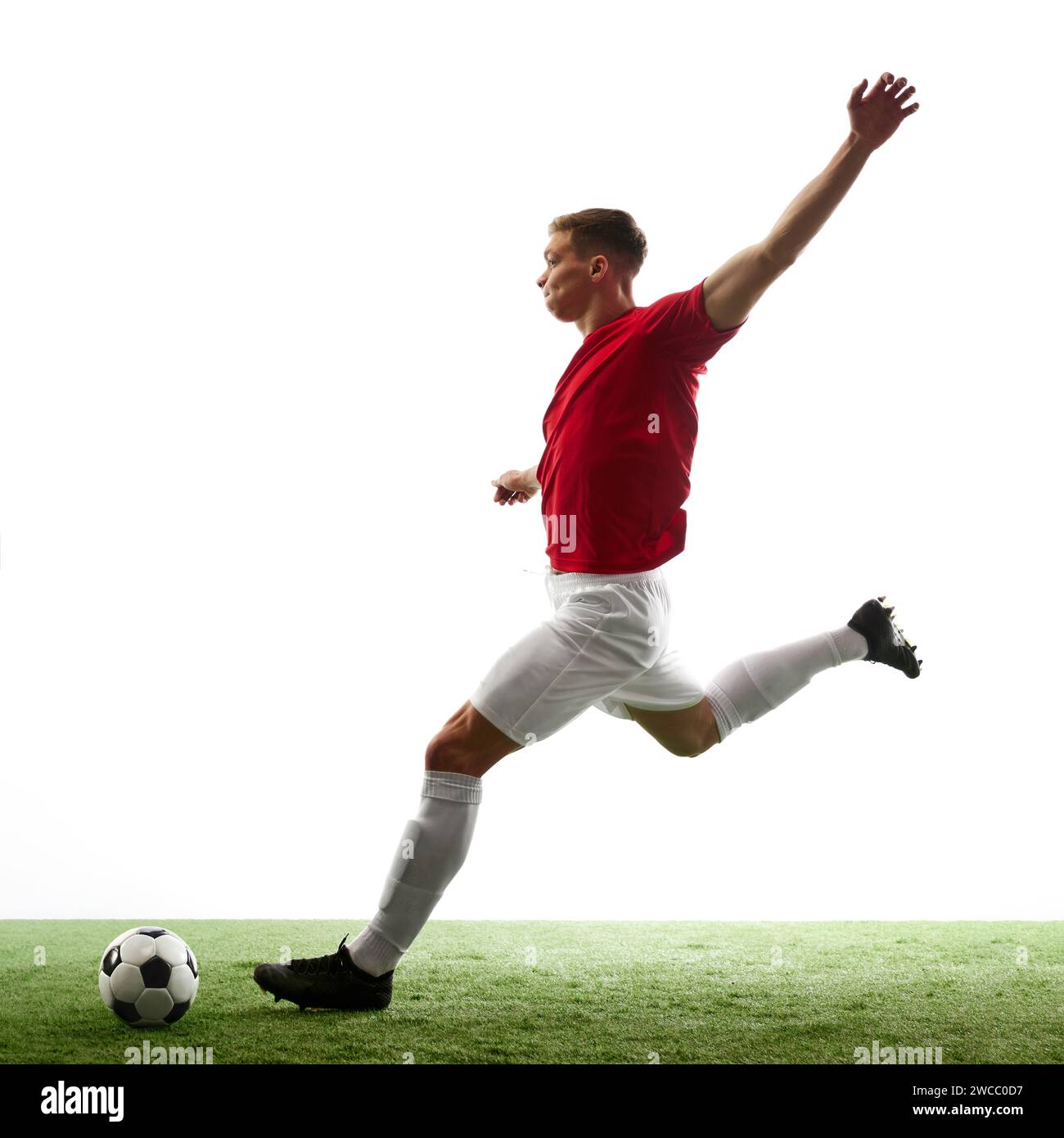 Goal bound elegance. Grace and power of a professional footballer mid ...