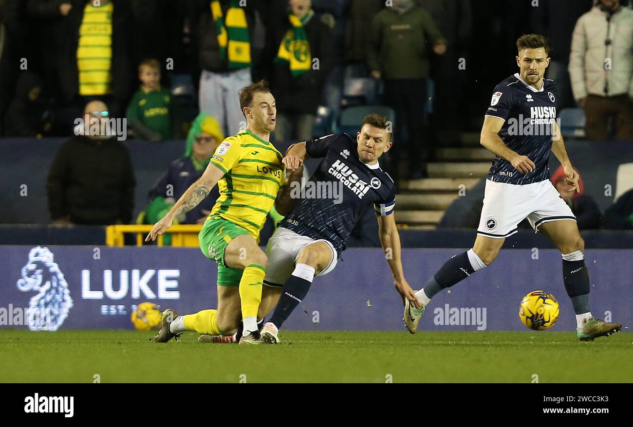 Ashley Barnes of Norwich City battles for the ball with Shaun ...