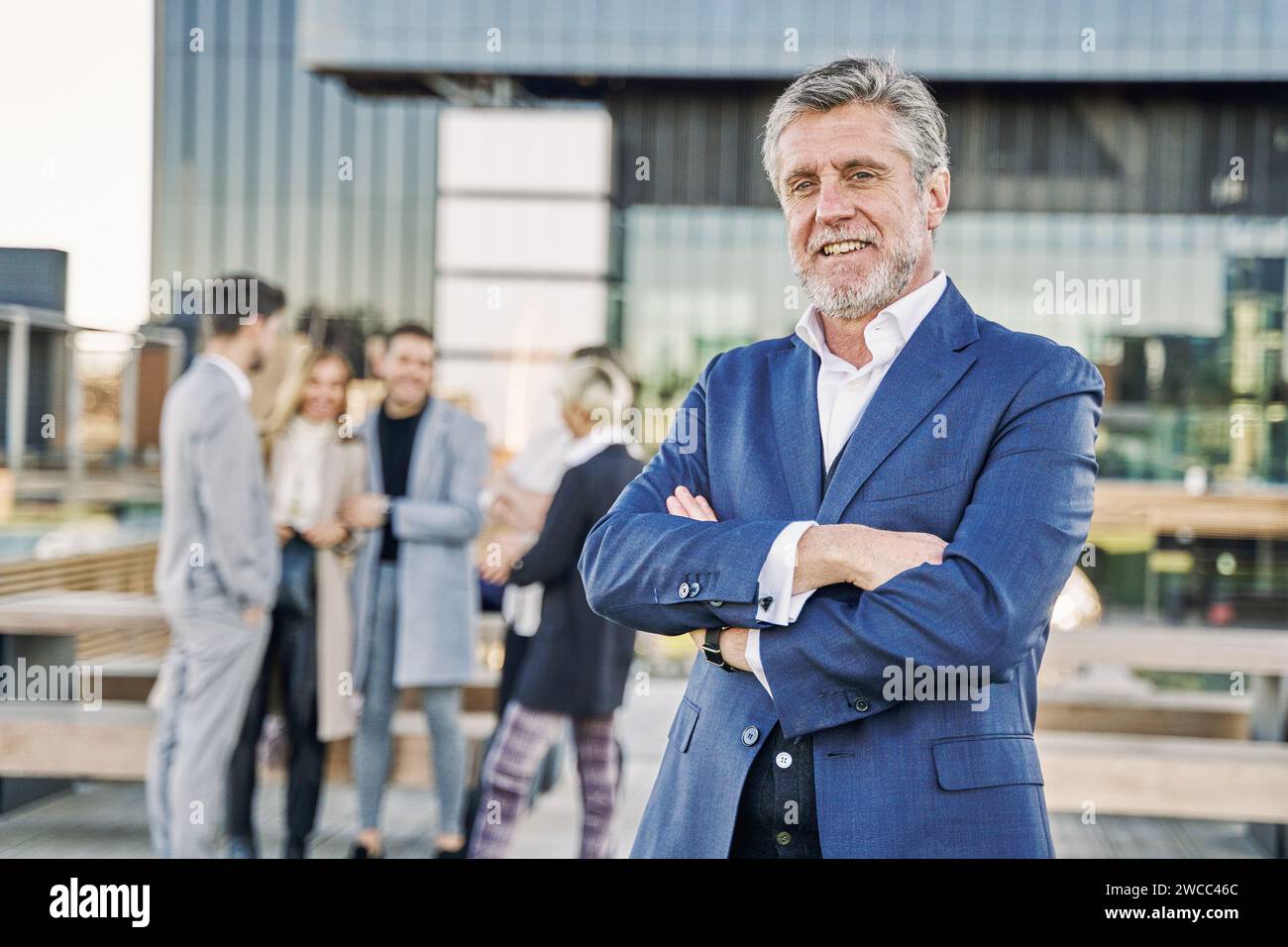 Professional business team crossing arms hi-res stock photography and ...