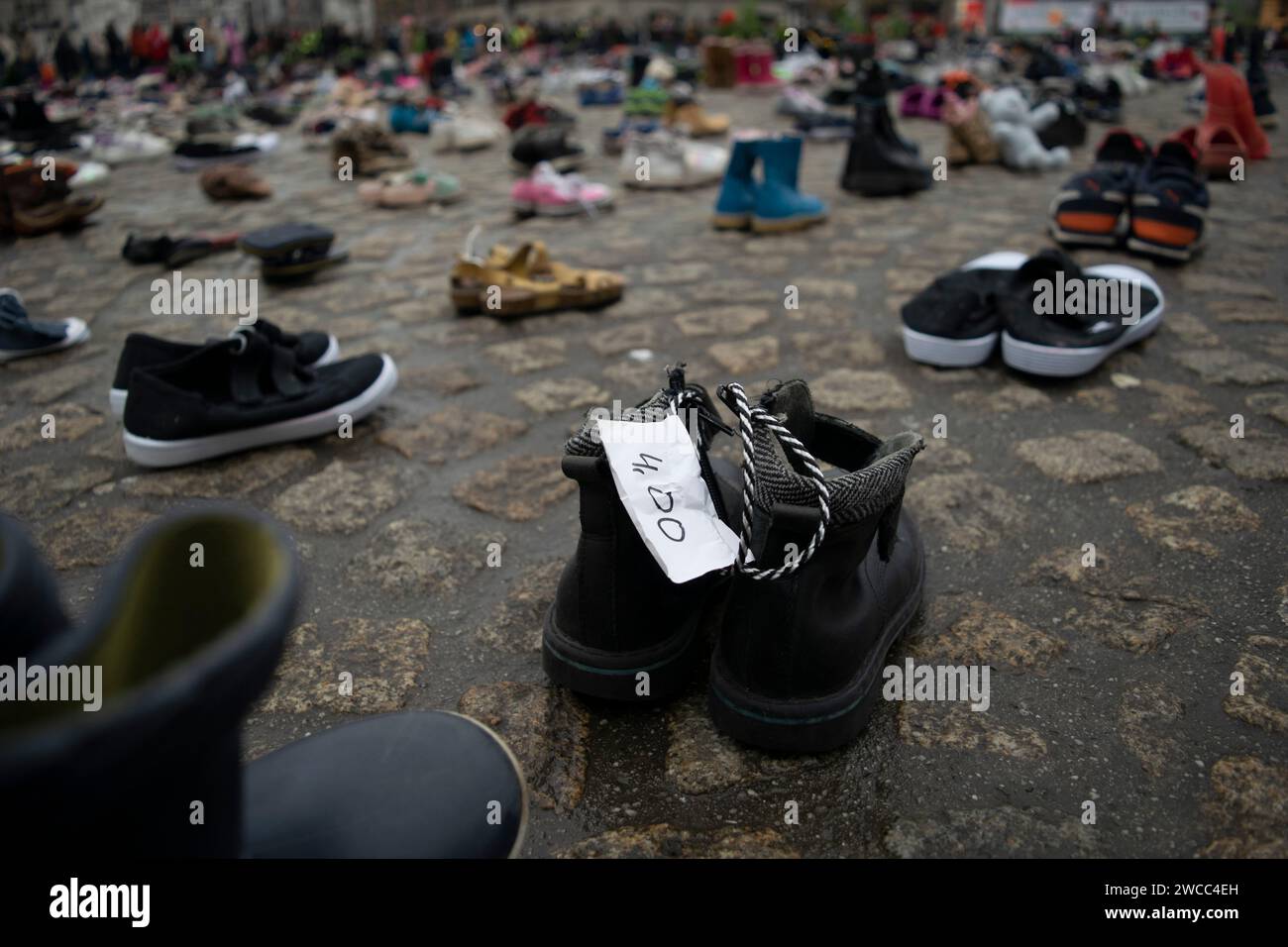 People place thousands of children's shoes are placed on Dam Square ...
